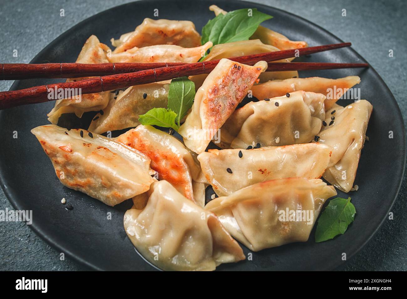 Japanese fried dumplings, gyoza, sesame seeds, top view, no people ...