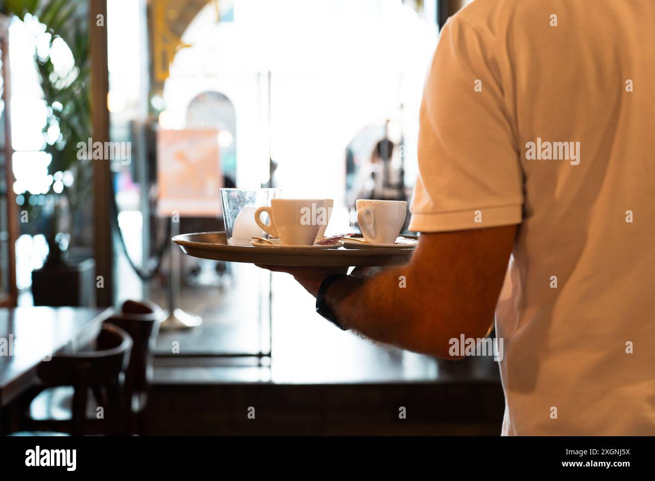 Male carrying tray hi-res stock photography and images - Alamy