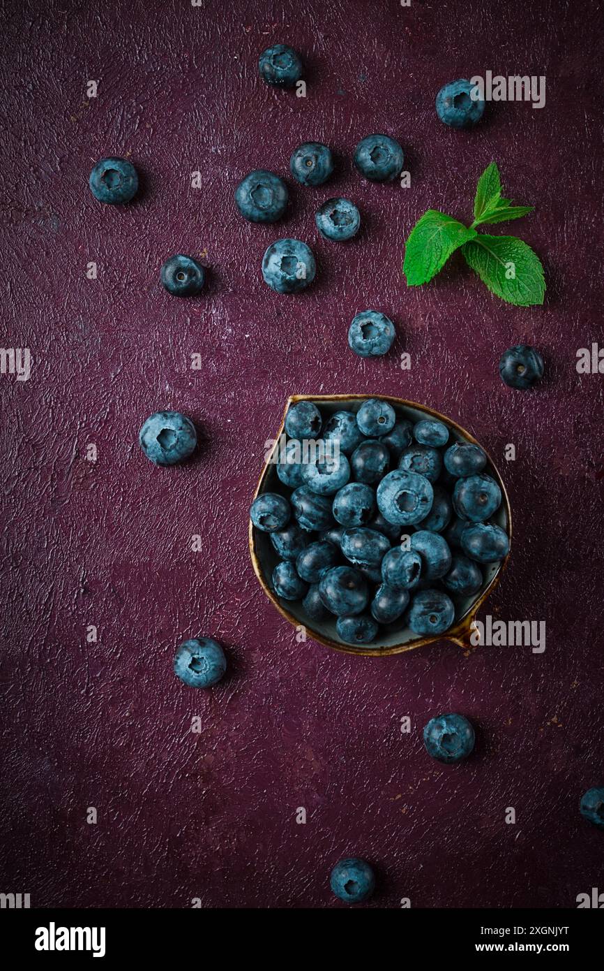 Fresh berries, Blueberries, on a maroon background, food concept ...