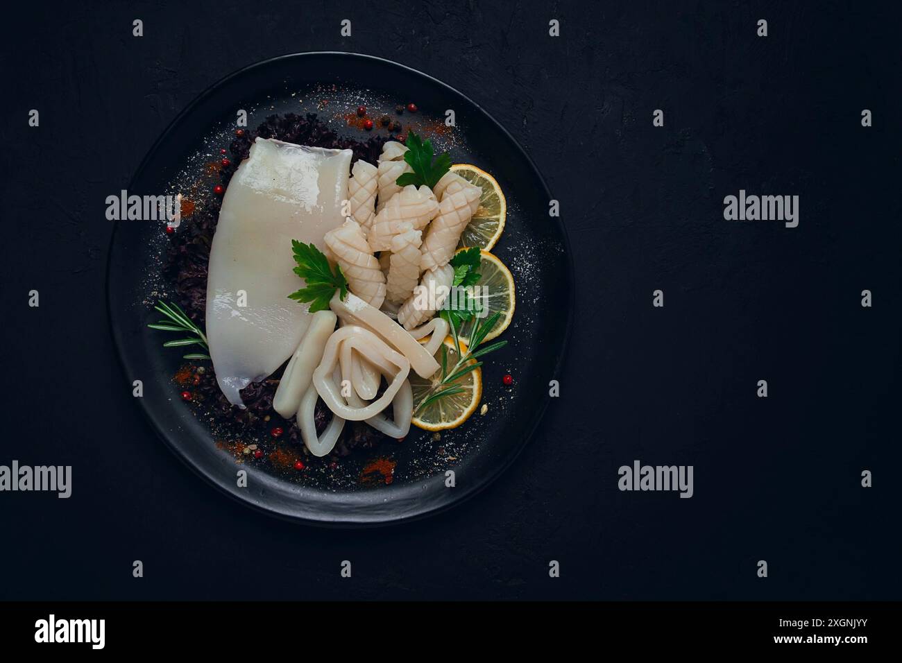 Raw squid rings hi-res stock photography and images - Alamy