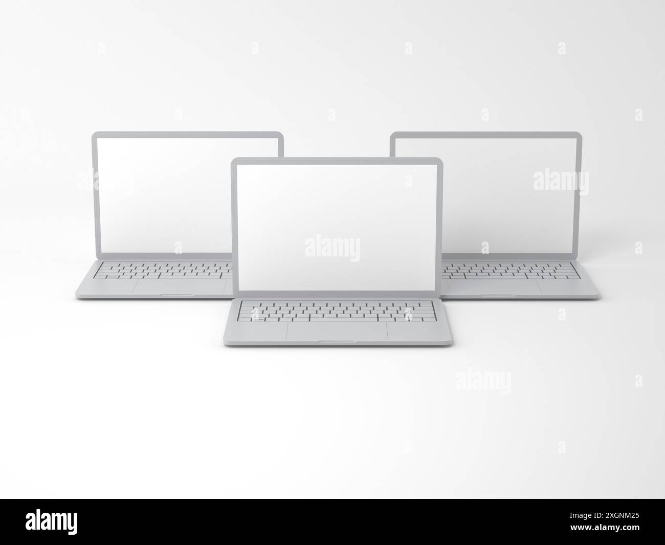 Three sleek, unlabeled laptops on a white background with blank screens ...