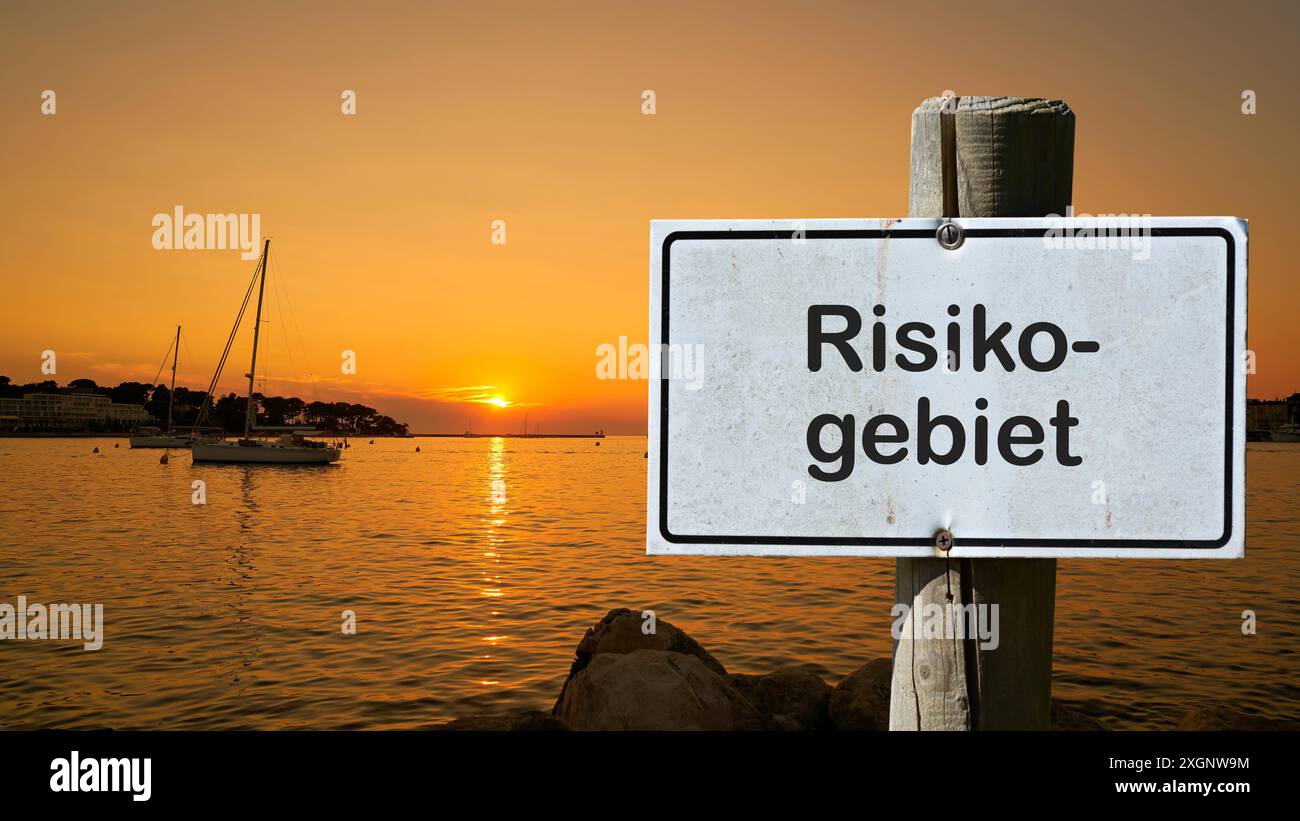 Sign with the inscription risk area. Due to many new corona infections ...
