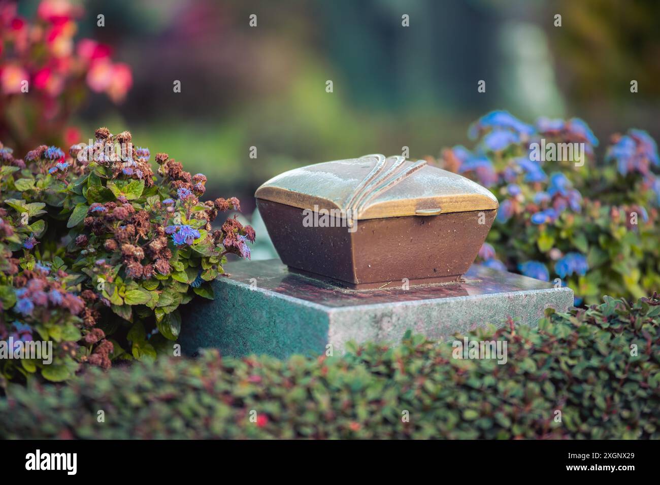 Holy water in iron bowl, cemetery Stock Photo - Alamy