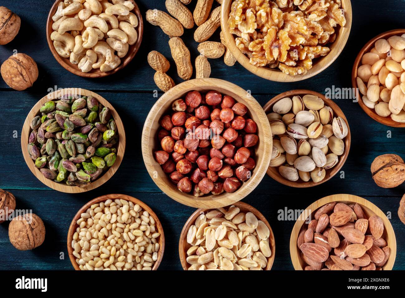 Nuts variety flat lay. Many different nuts, shot from the top on a dark ...