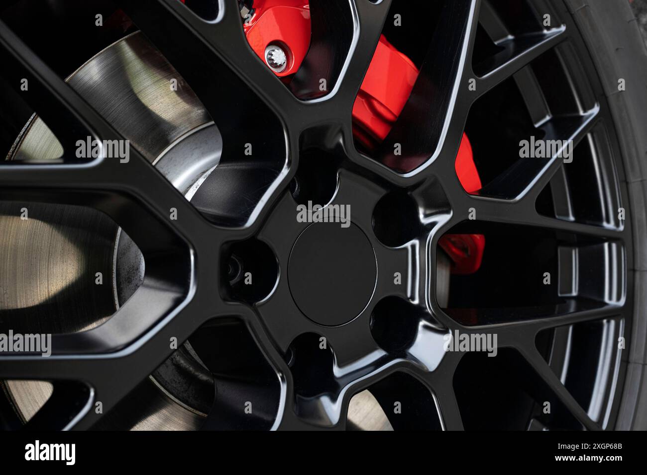 Black Wheel rim and red brake caliper of a sport car. Close up Stock ...