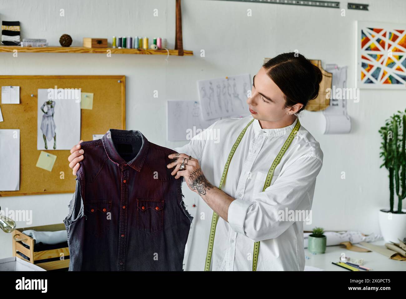 A young man examines a discarded piece of clothing, ready to give it a ...