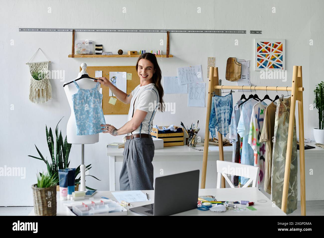 A young man in a DIY clothing restoration atelier, showcasing his ...