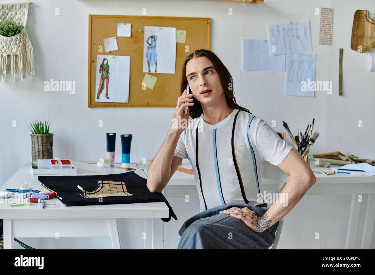Man working on a diy project with his phone hi-res stock photography ...
