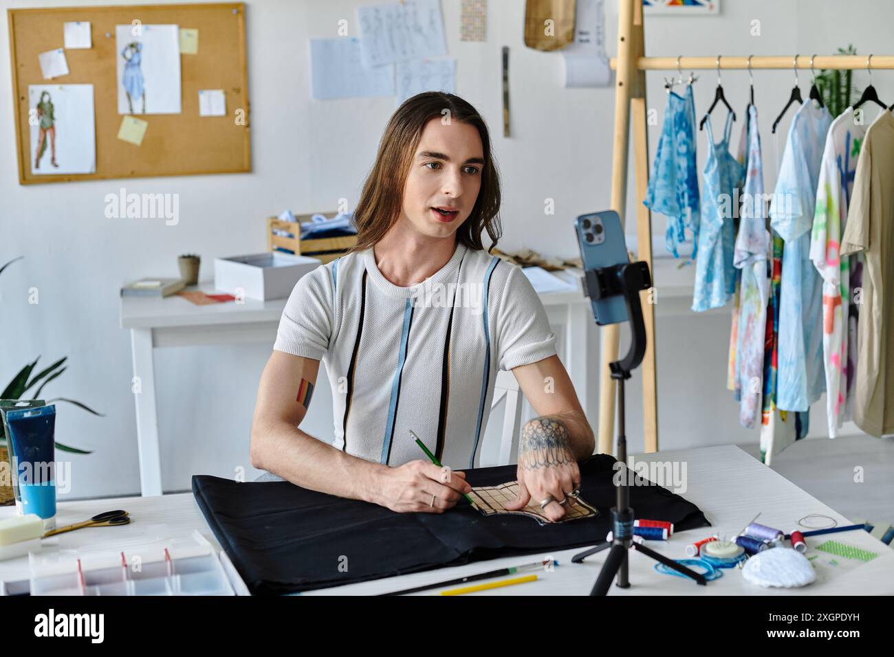 A young influencer with long hair works on restoring a piece of ...