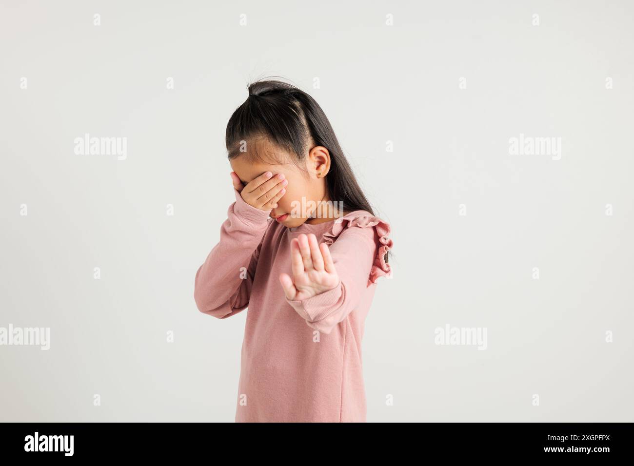 Stop hand of kindergarten child. Asian little kid girl doing stop sing ...