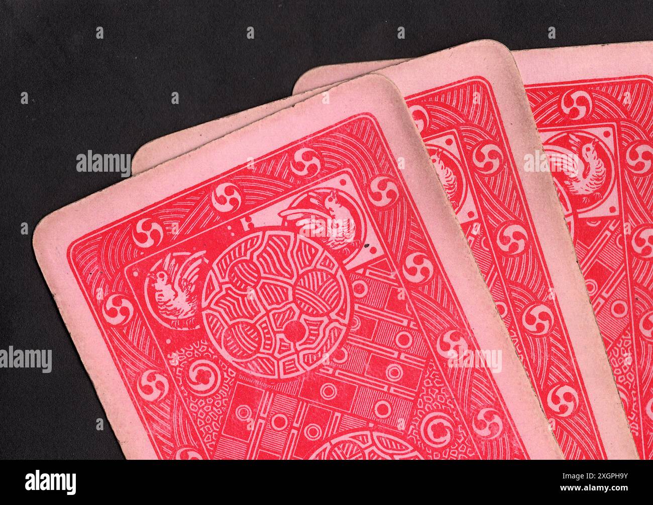 Vintage playing card backs on a black background Stock Photo - Alamy