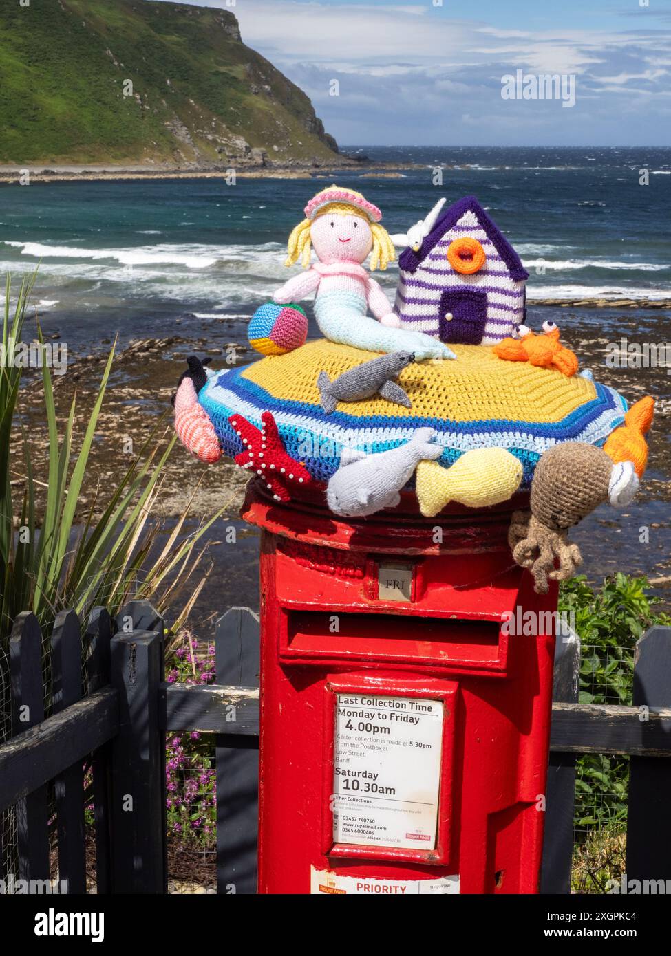 A yarn bombing scene on a post box in Gardenstown in Aberdeenshire ...