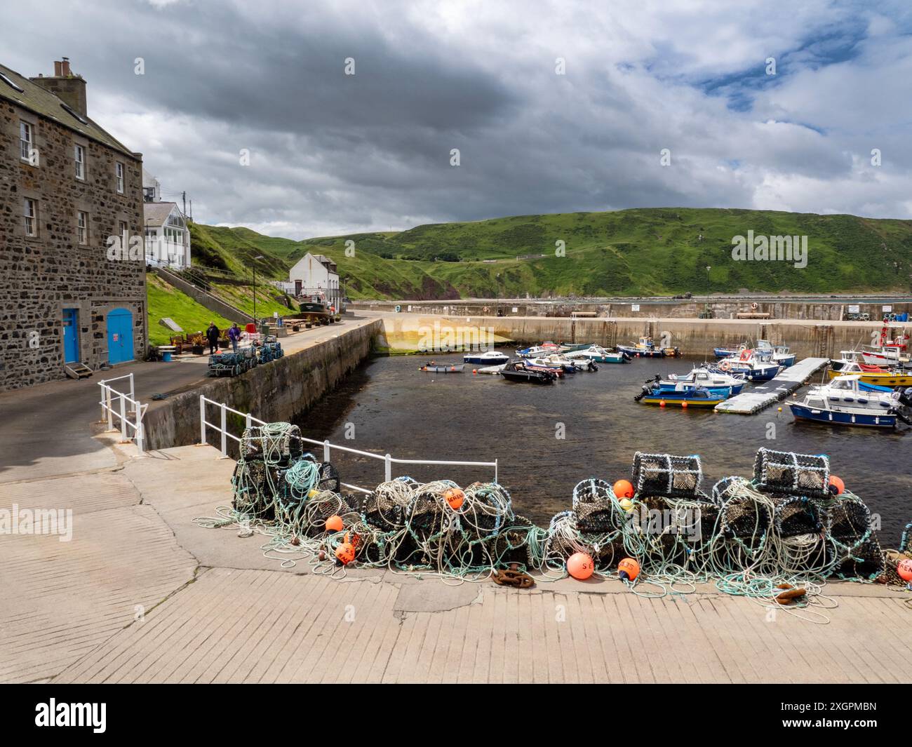Boats in the harbour at Gardenstown in Aberdeenshire, Scotland, UK ...