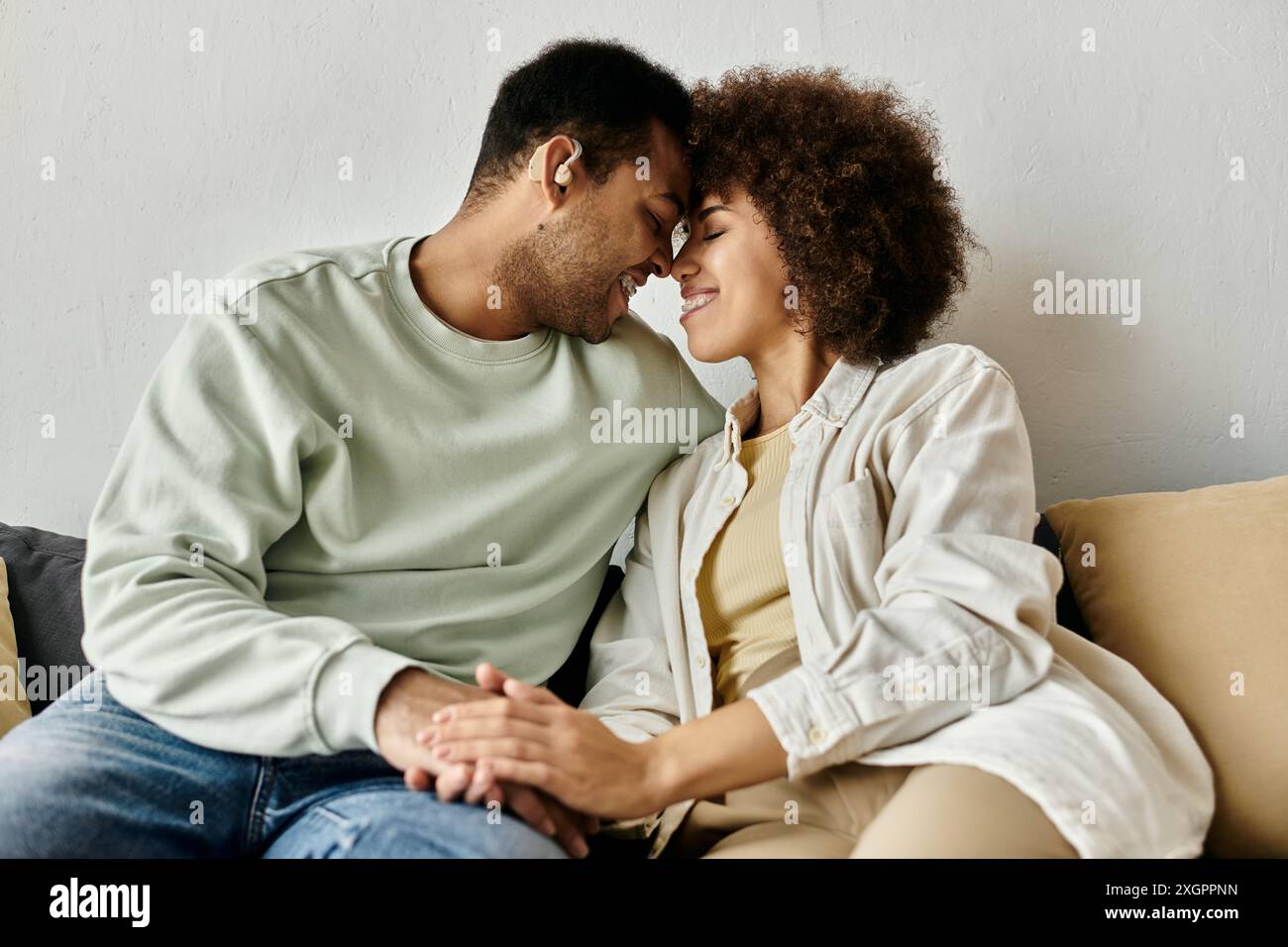 African american couple sitting hi-res stock photography and images - Alamy