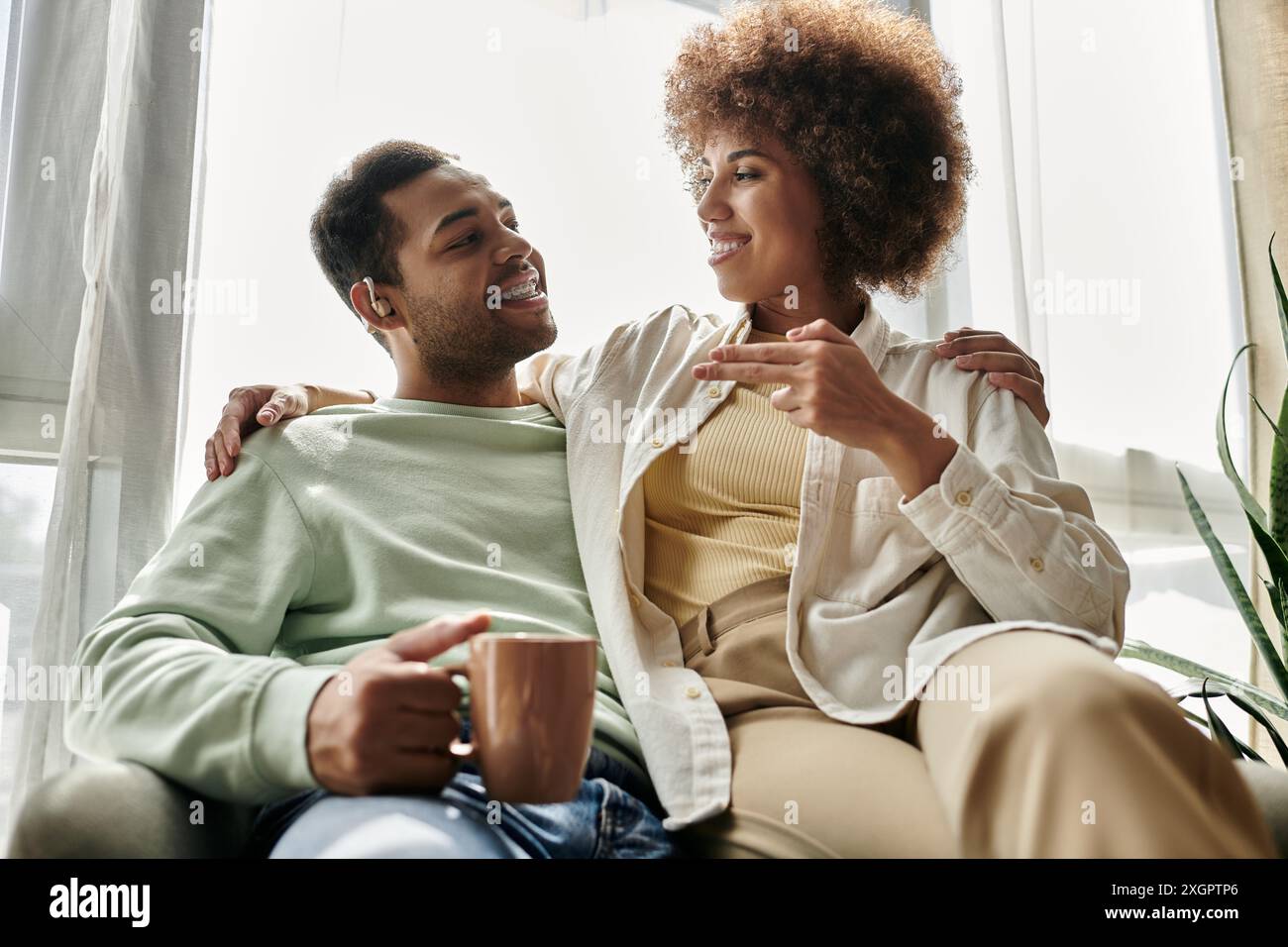 An African American couple shares a loving conversation using sign ...