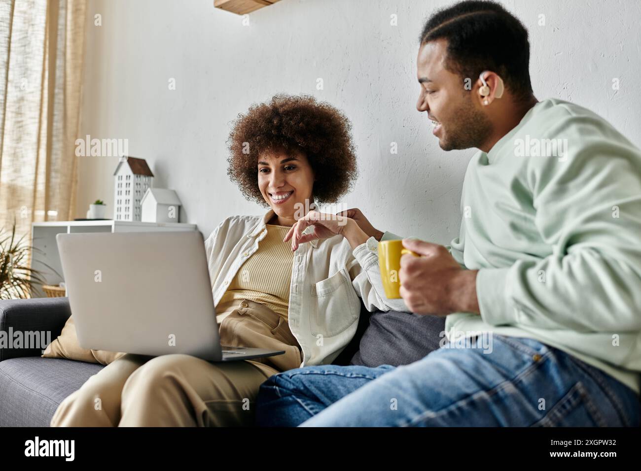 An attractive African American couple communicates using sign language ...