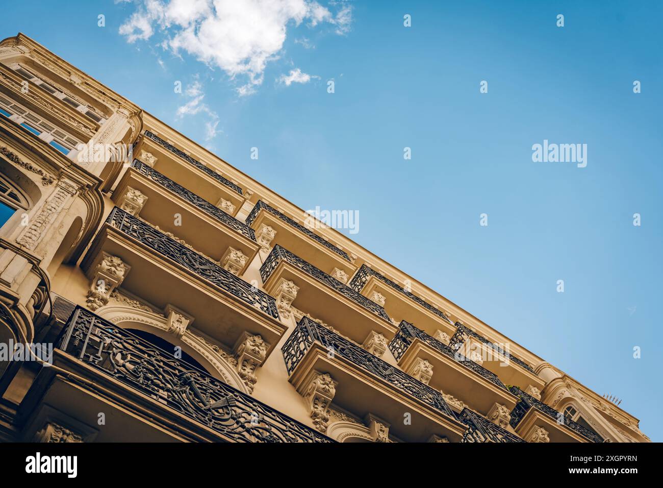 Upward perspective of a historic building facade in Valencia. Detailed ...
