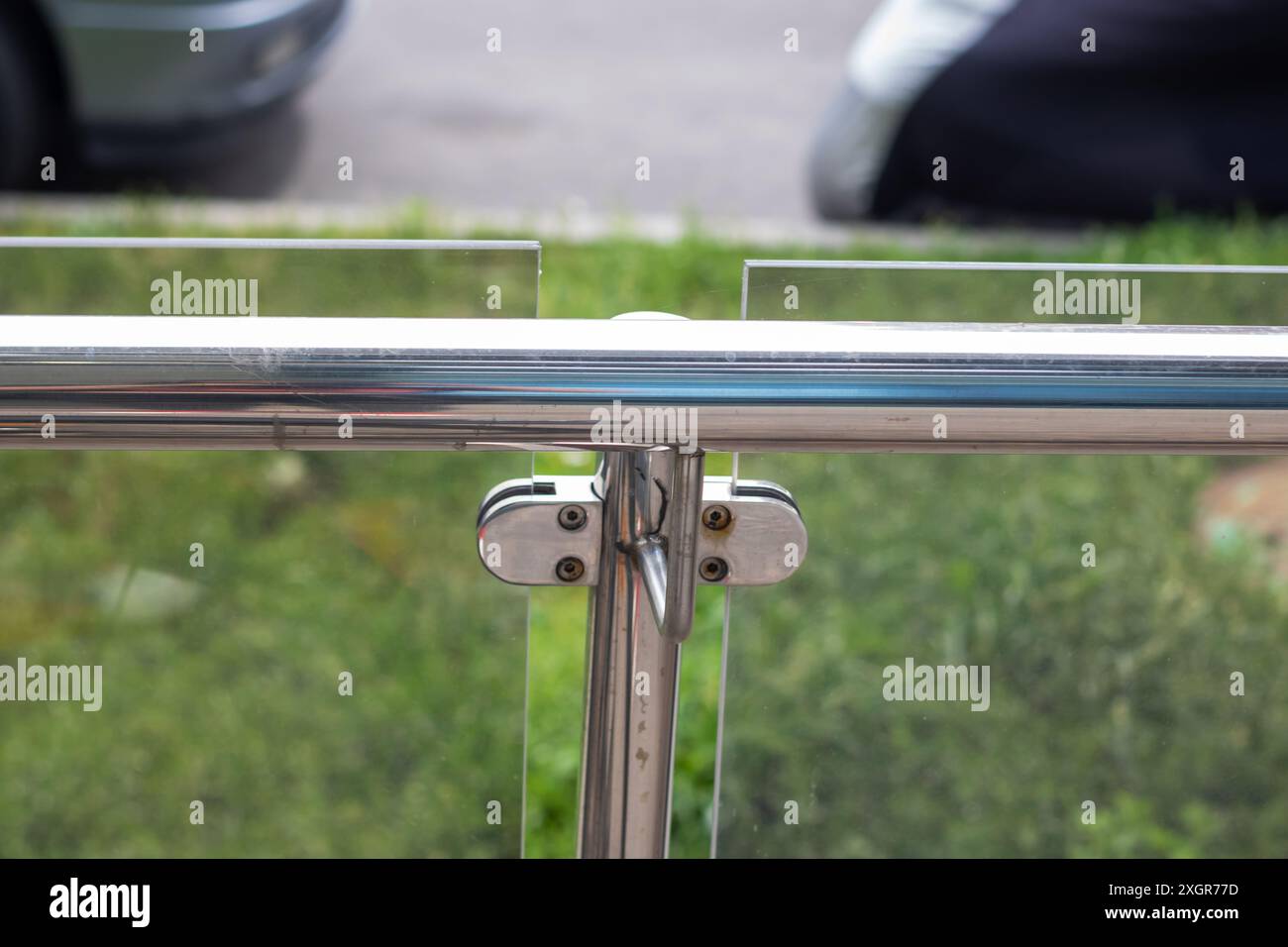 A close up photo showing a stainless steel railing with transparent ...