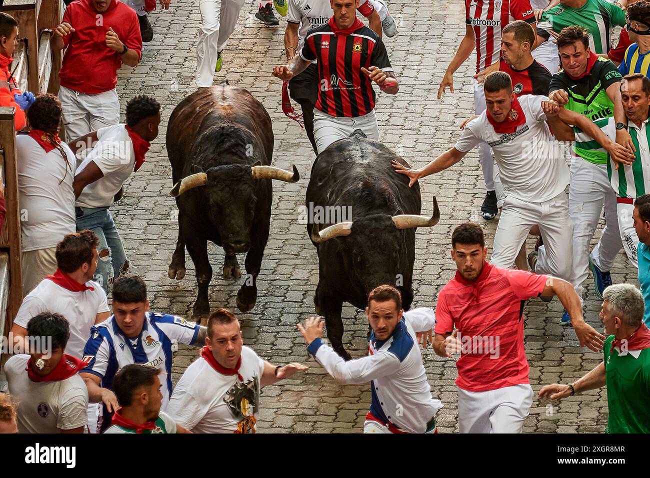 Pamplona, Spain. 10th July, 2024. Several young men run in front of the ...