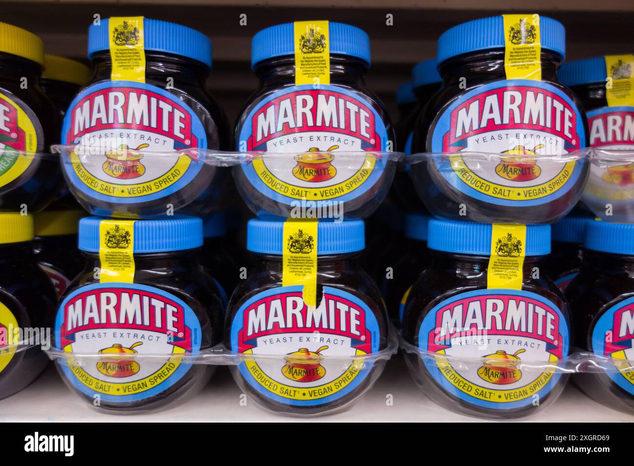 Close Up shot of jars of Marmite yeast extract stacked on a supermarket ...