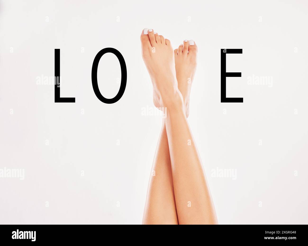Closeup, legs and woman with love, sign and text with beauty on grey ...