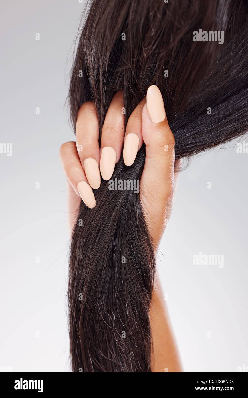 Hands, hair care and woman for health in studio with luxury salon ...