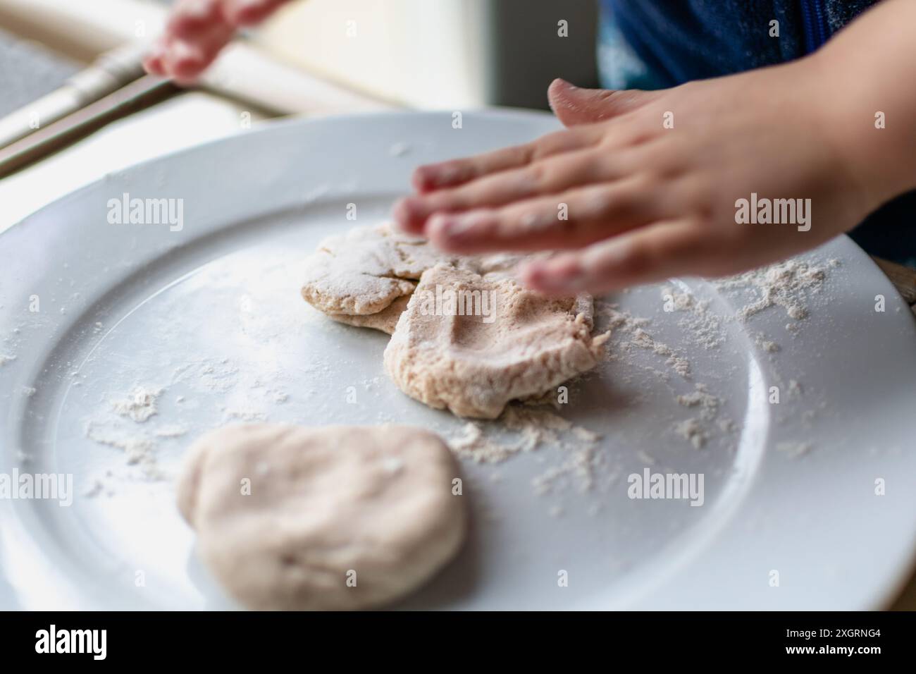 Child having fun modeling salt dough, authentic activity, fine motor ...