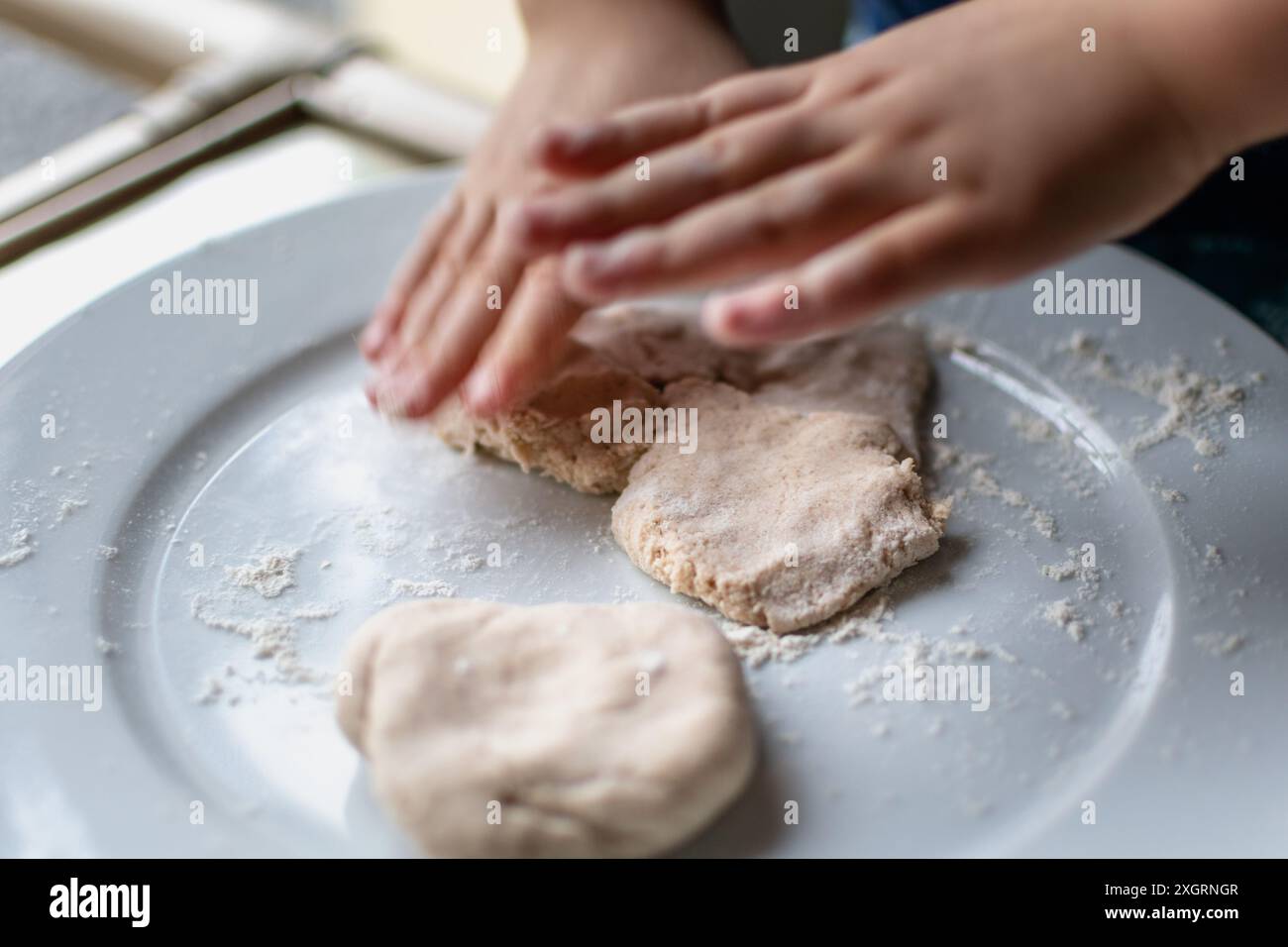 Child having fun modeling salt dough, authentic activity, fine motor ...
