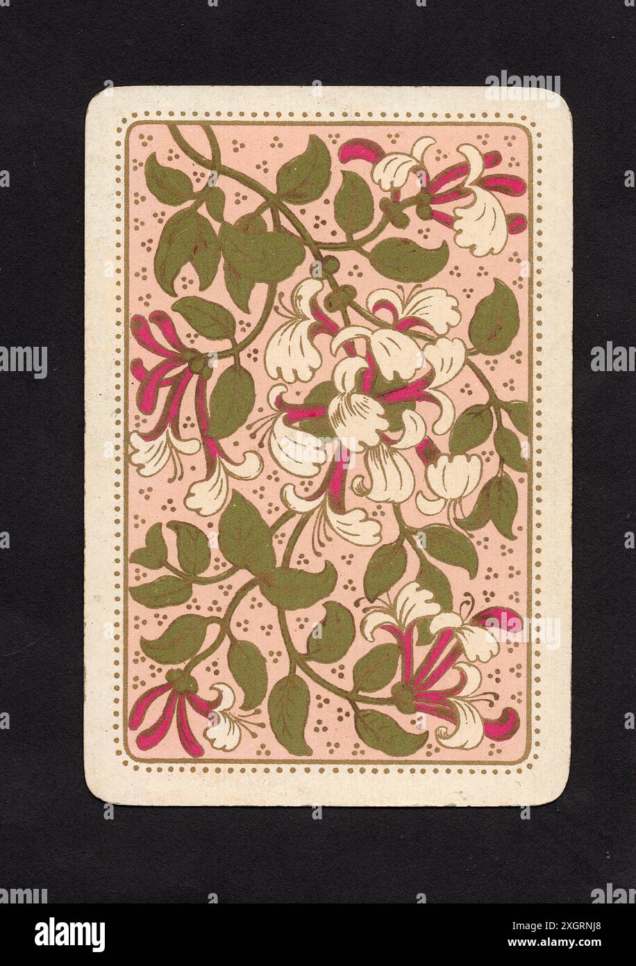A vintage playing card back on a black background Stock Photo - Alamy
