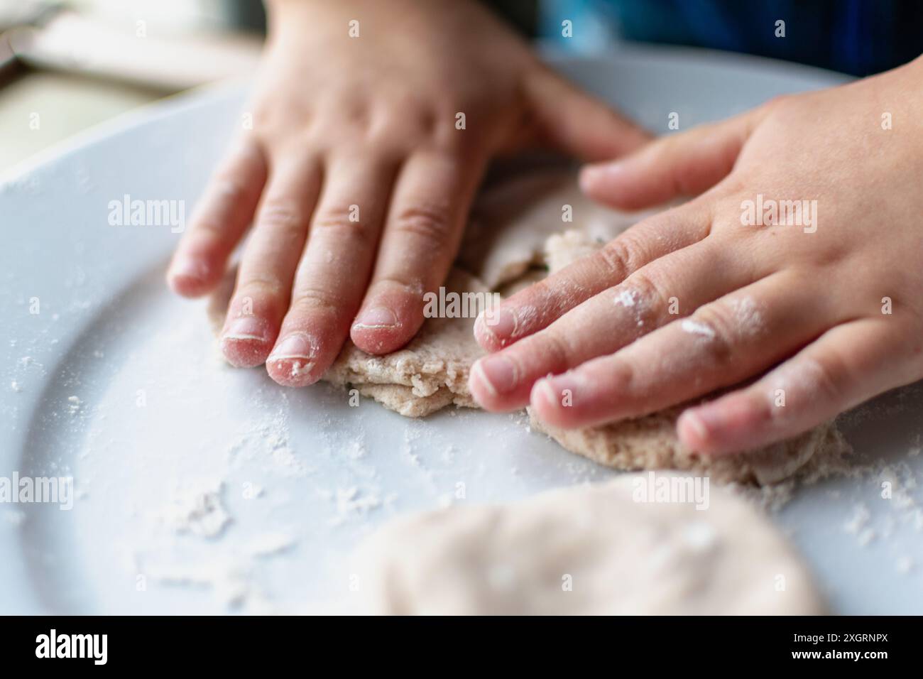 Child having fun modeling salt dough, authentic activity, fine motor ...