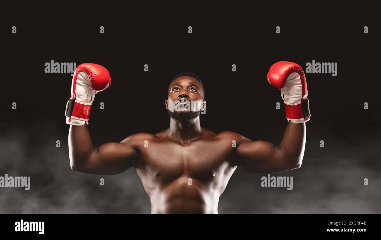 Boxer Celebrating Victory With Arms Raised Stock Photo - Alamy
