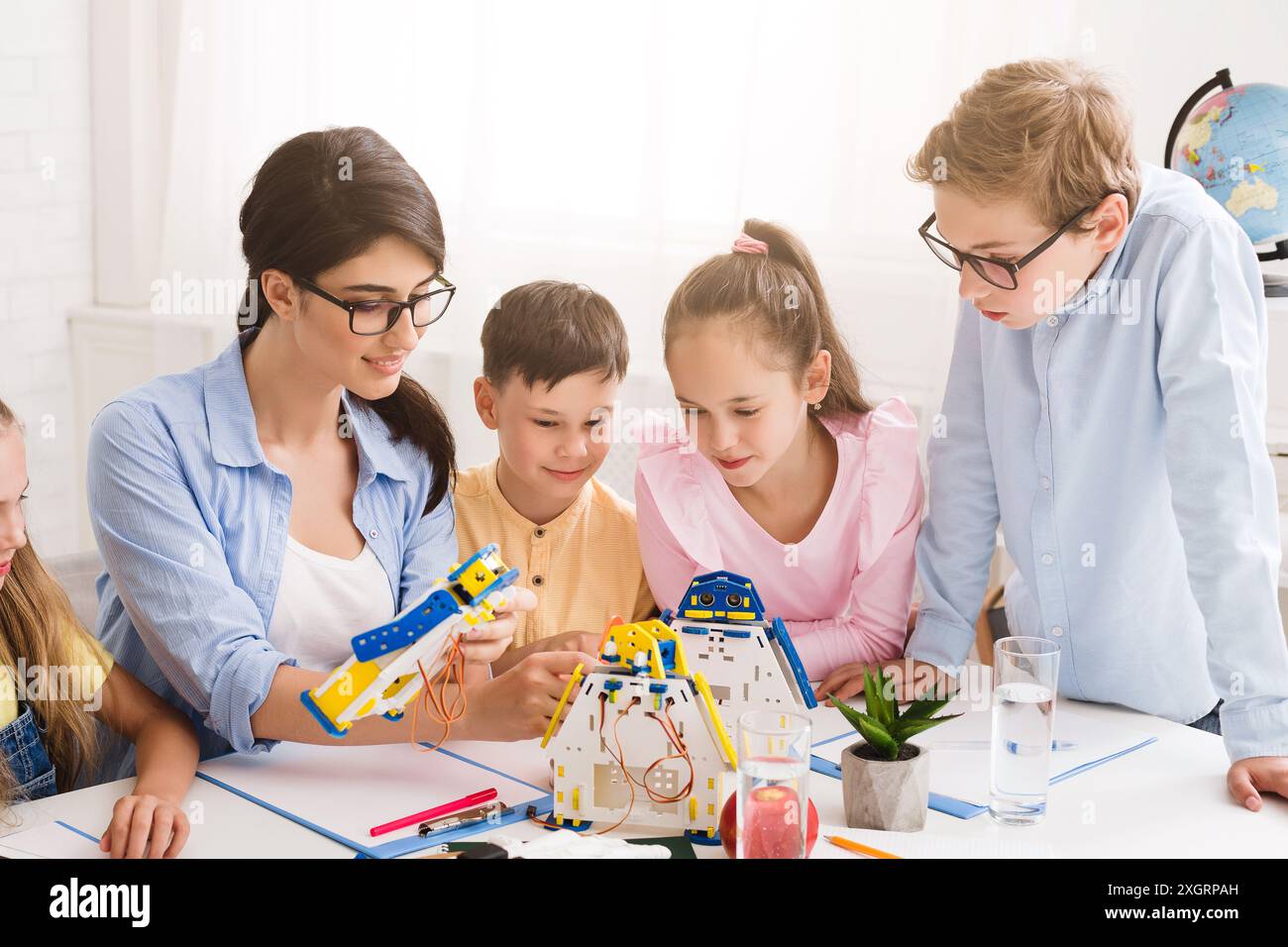 Teacher and Students Building a Robot in Classroom Stock Photo - Alamy
