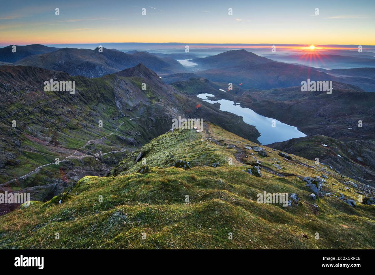 Sunrise as seen from the top of Snowdon, in the Snowdonia National Park ...