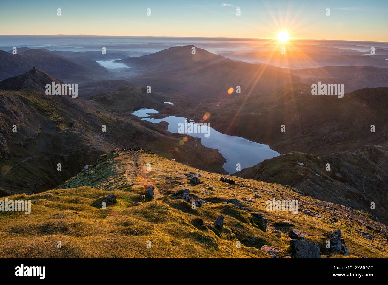 Sunrise as seen from the top of Snowdon, in the Snowdonia National Park ...