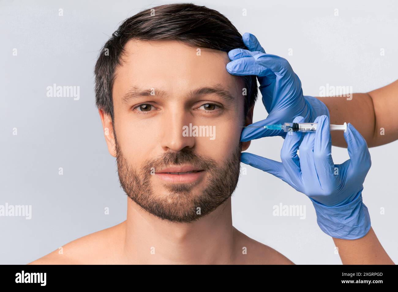 Portrait Of Middle-Aged Man Receiving Wrinkle-Removing Injection, White ...