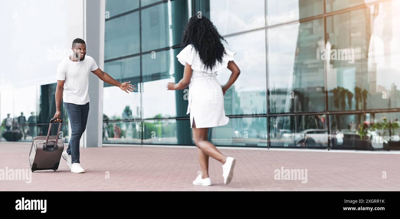 Man Welcoming Woman Arriving at Airport Terminal Stock Photo - Alamy