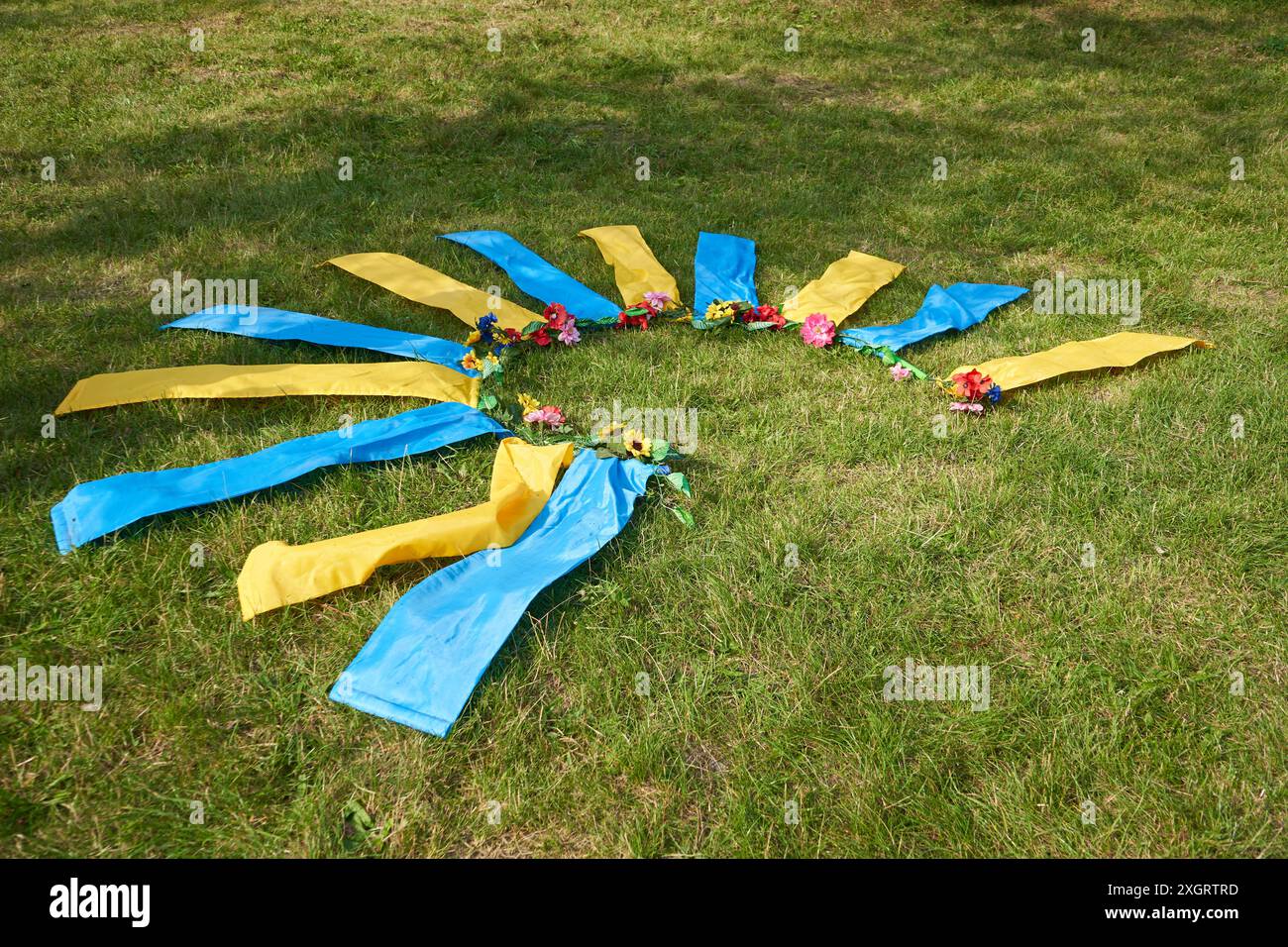 big ukrainian wreath with blue and yellow ribbons on the grass ...
