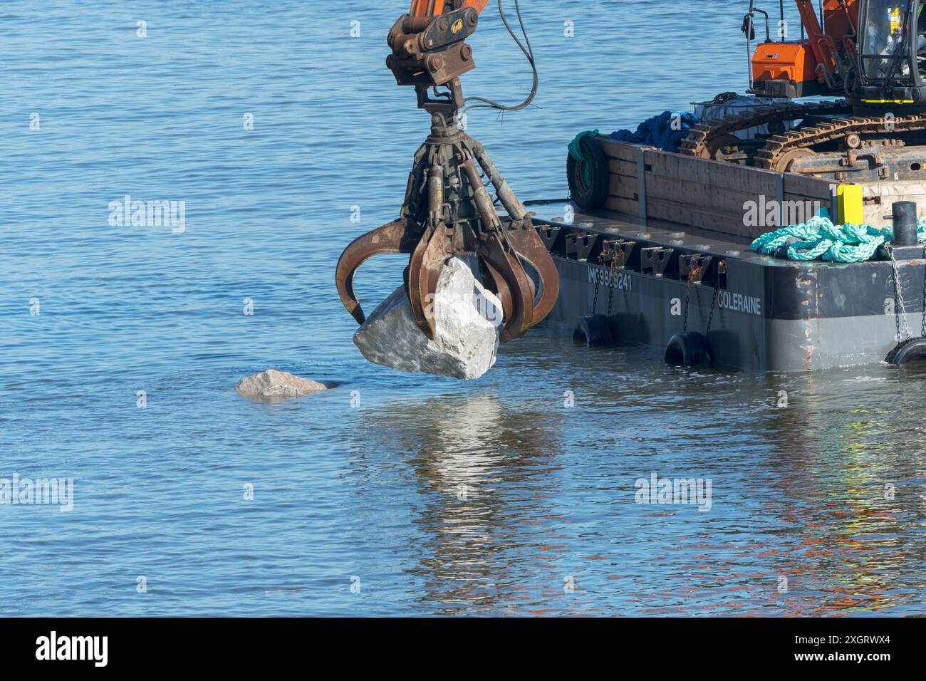 coastal erosion protection work with machinery on barge, at sea, Cromer ...