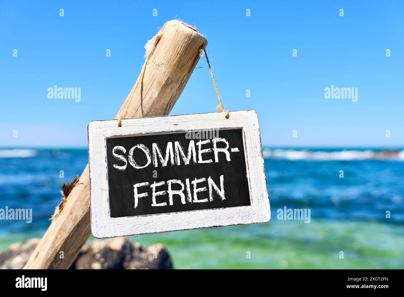 10 July 2024: Summer vacation Sign by the sea. Symbolic image of the ...