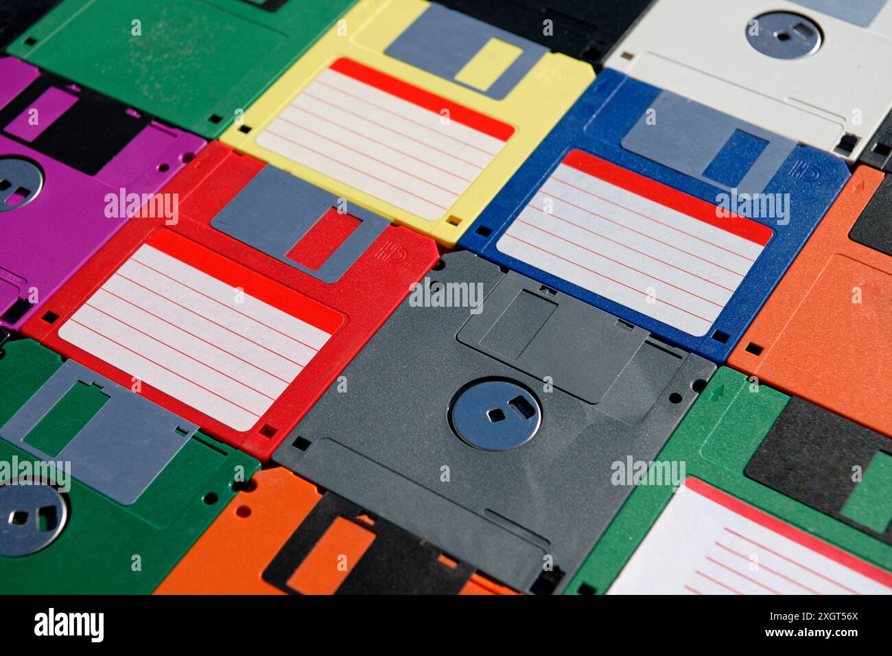 Vintage colored floppy disks background. Old technologies. Selective ...
