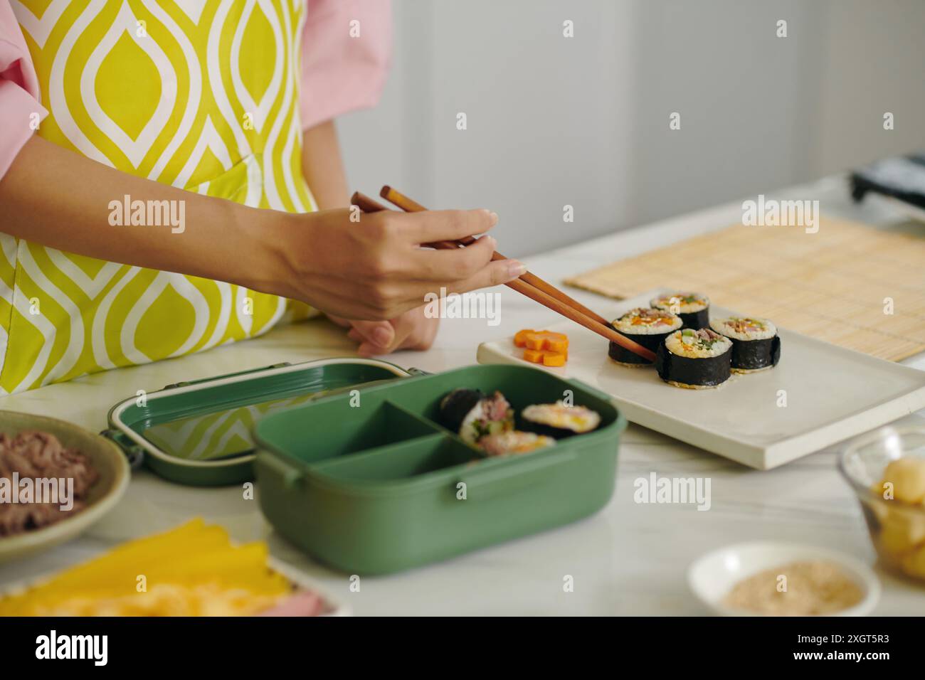 Housewife Packing Kimbap With Sticks Stock Photo - Alamy