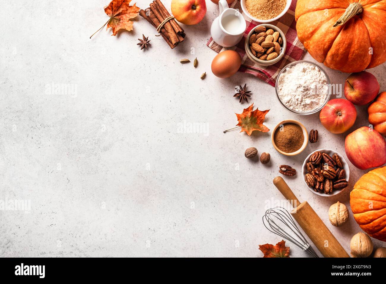 Autumn fall baking composition with pumpkins, apples, nuts, food ...