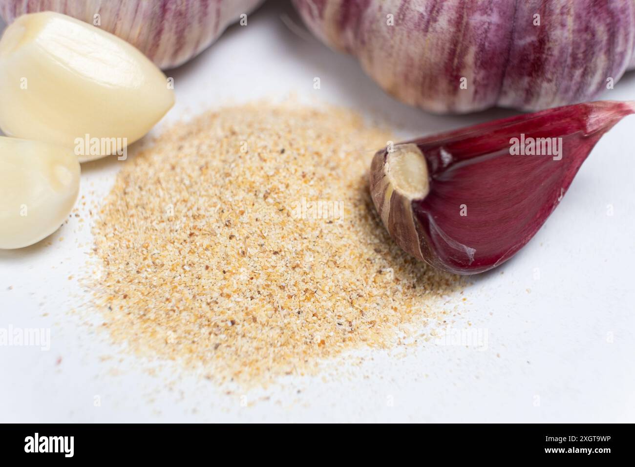 Ground dried garlic powder, natural spice, white background Stock Photo ...