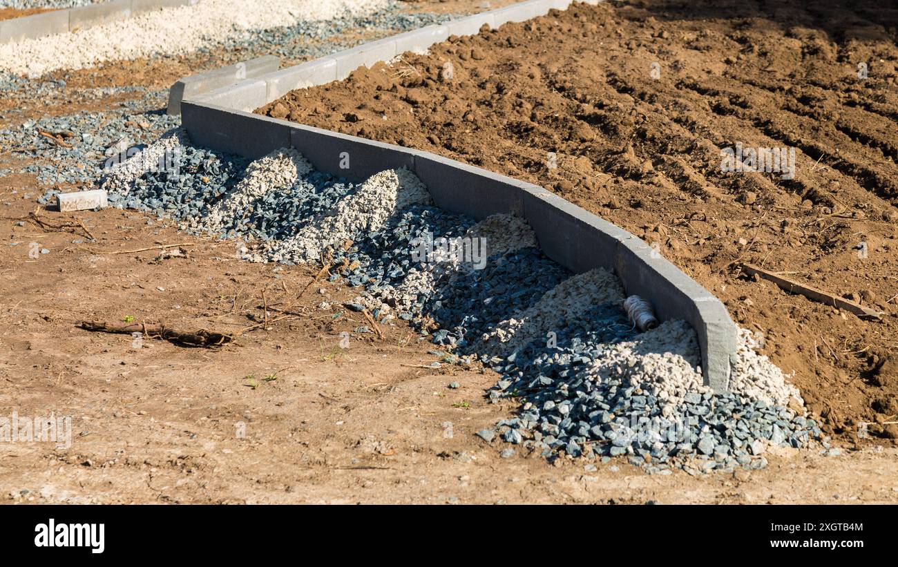 Installing curb stone hi-res stock photography and images - Alamy