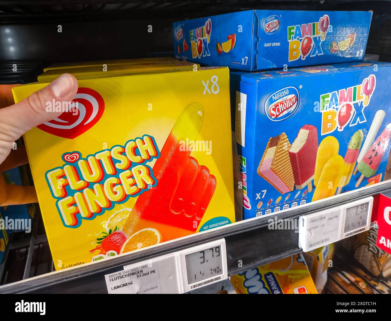 Bavaria, Germany - July 10, 2024: Customer reaches for a pack of ...