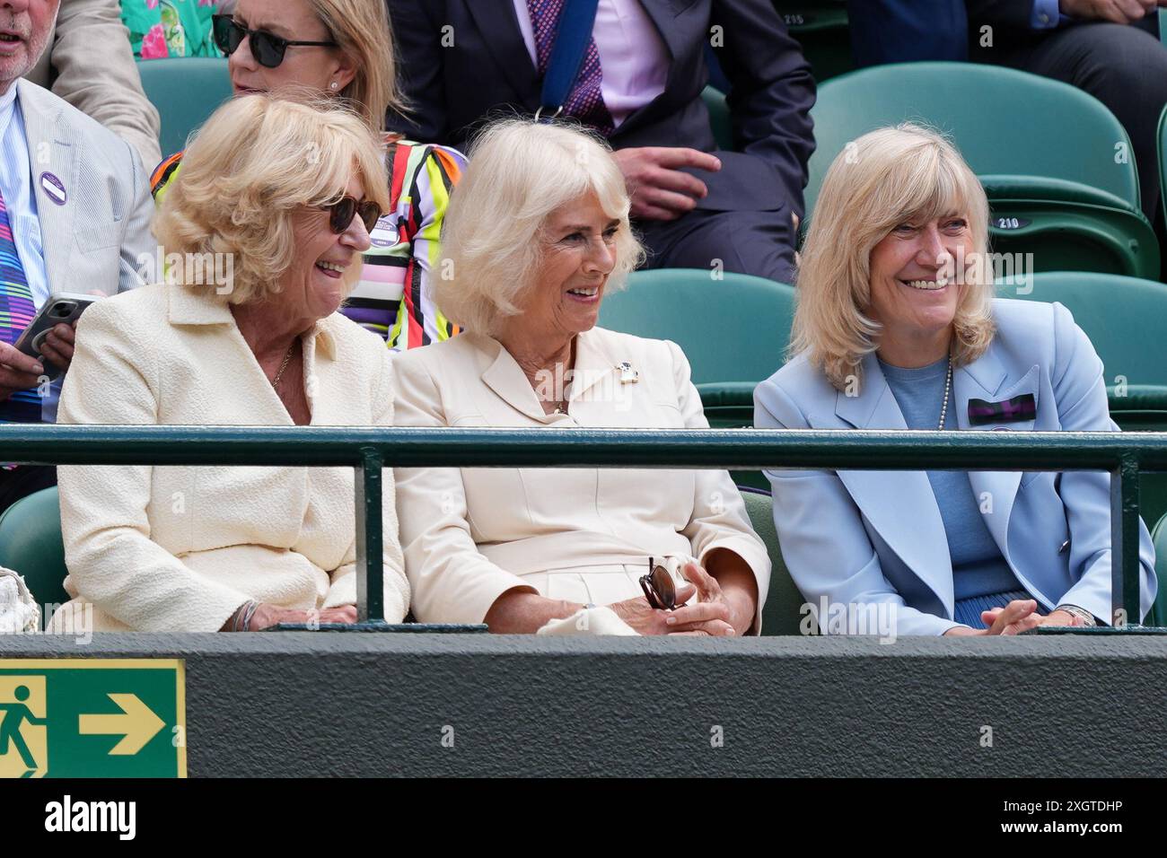 Queen Camilla (centre), Annabel Elliot (left), and Debbie Jevans chair ...