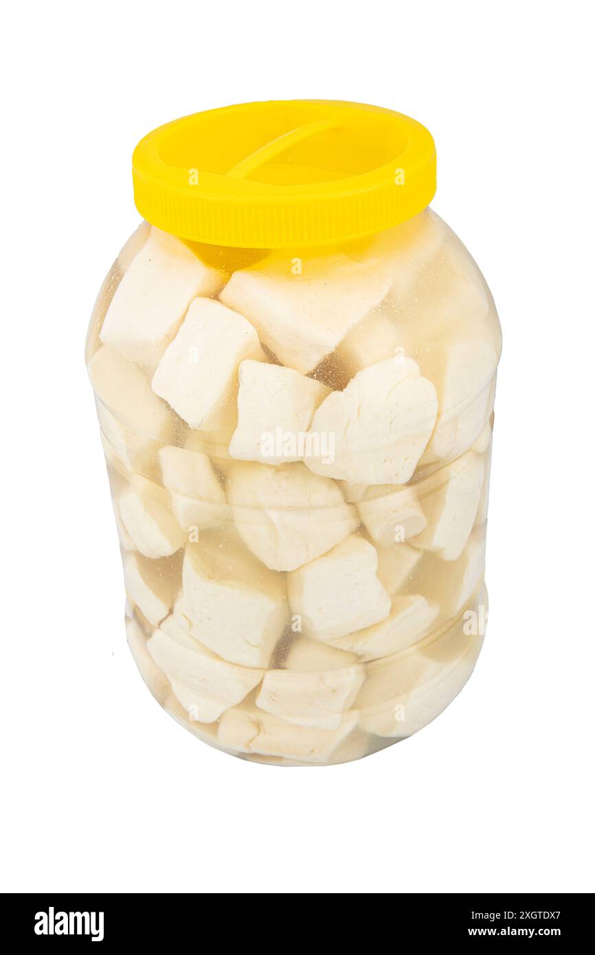 Pickled cow cheese in a five kilo container. Ready-to-eat white pickled ...