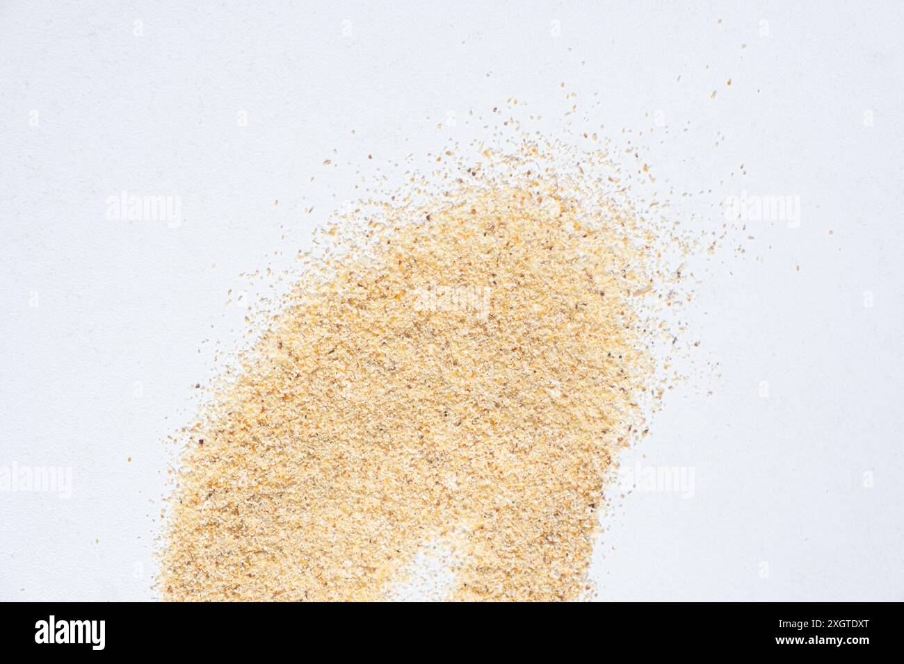Scattered garlic powder on white background, garlic spice pattern and ...