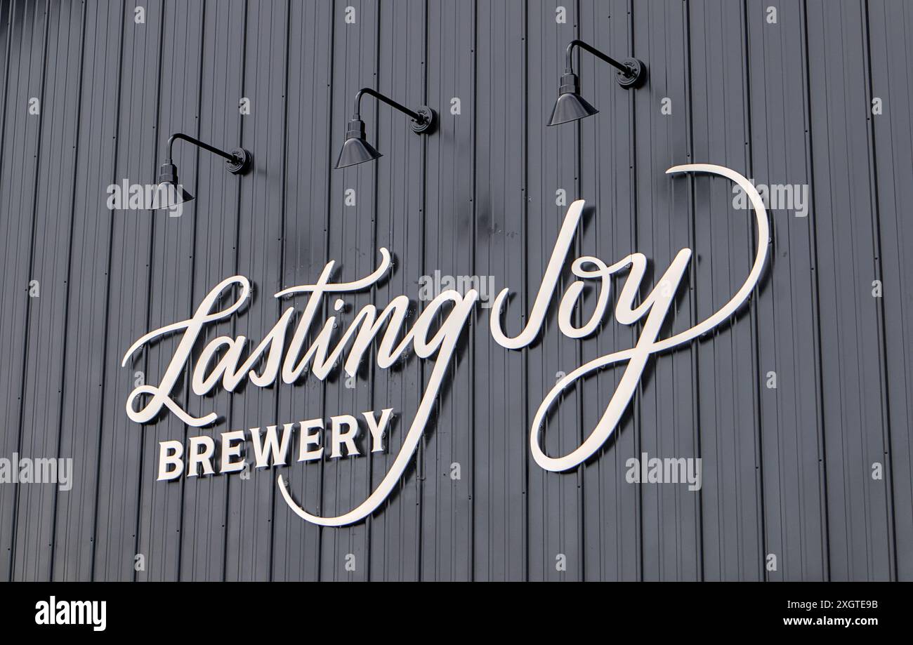 Tivoli, NY, USA - May 29, 2024: Lasting Joy Brewery logo sign near barn ...