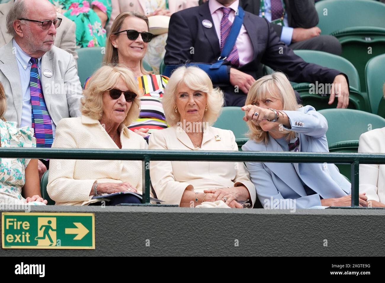 Queen Camilla (centre), Annabel Elliot (left), and Debbie Jevans chair ...